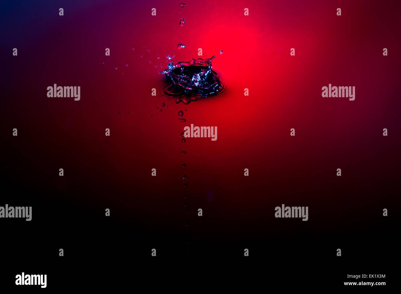 Drop of water splashing on surface Stock Photo - Alamy