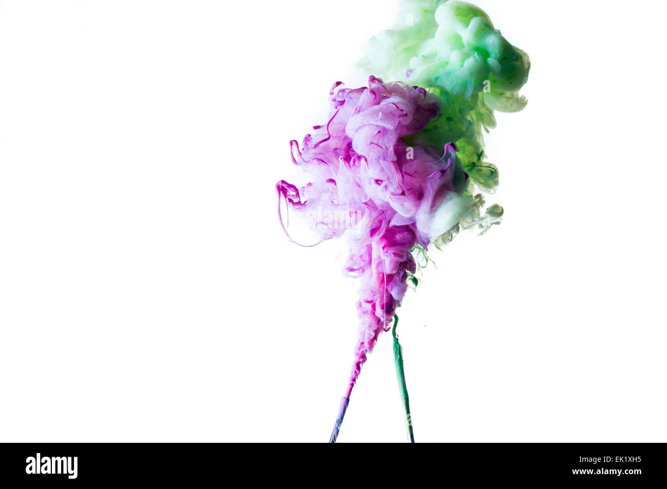 colorful ink creating smoke patterns in water Stock Photo - Alamy
