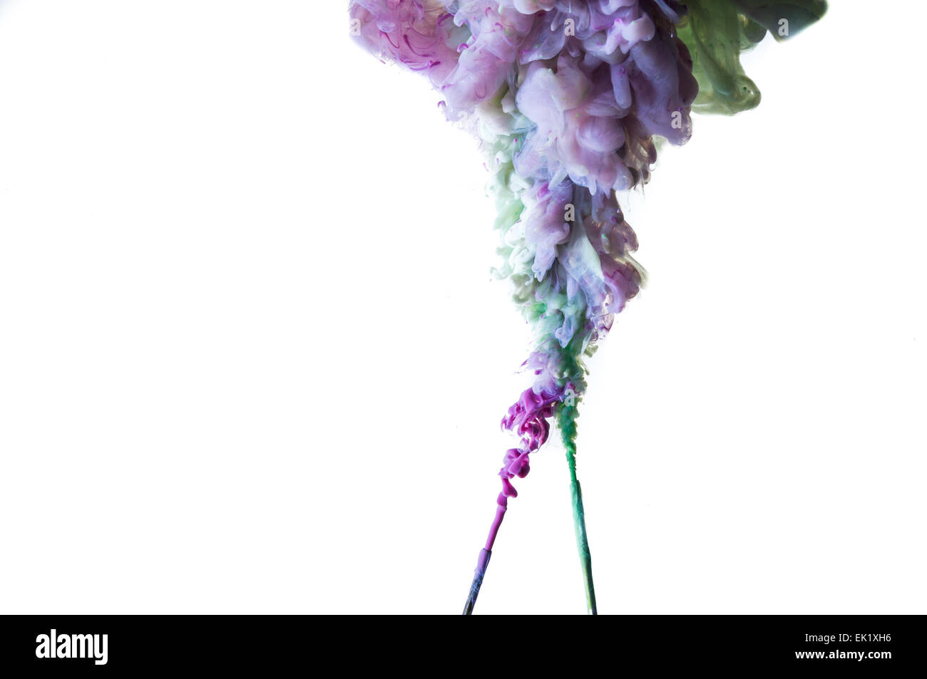 colorful ink creating smoke patterns in water Stock Photo - Alamy