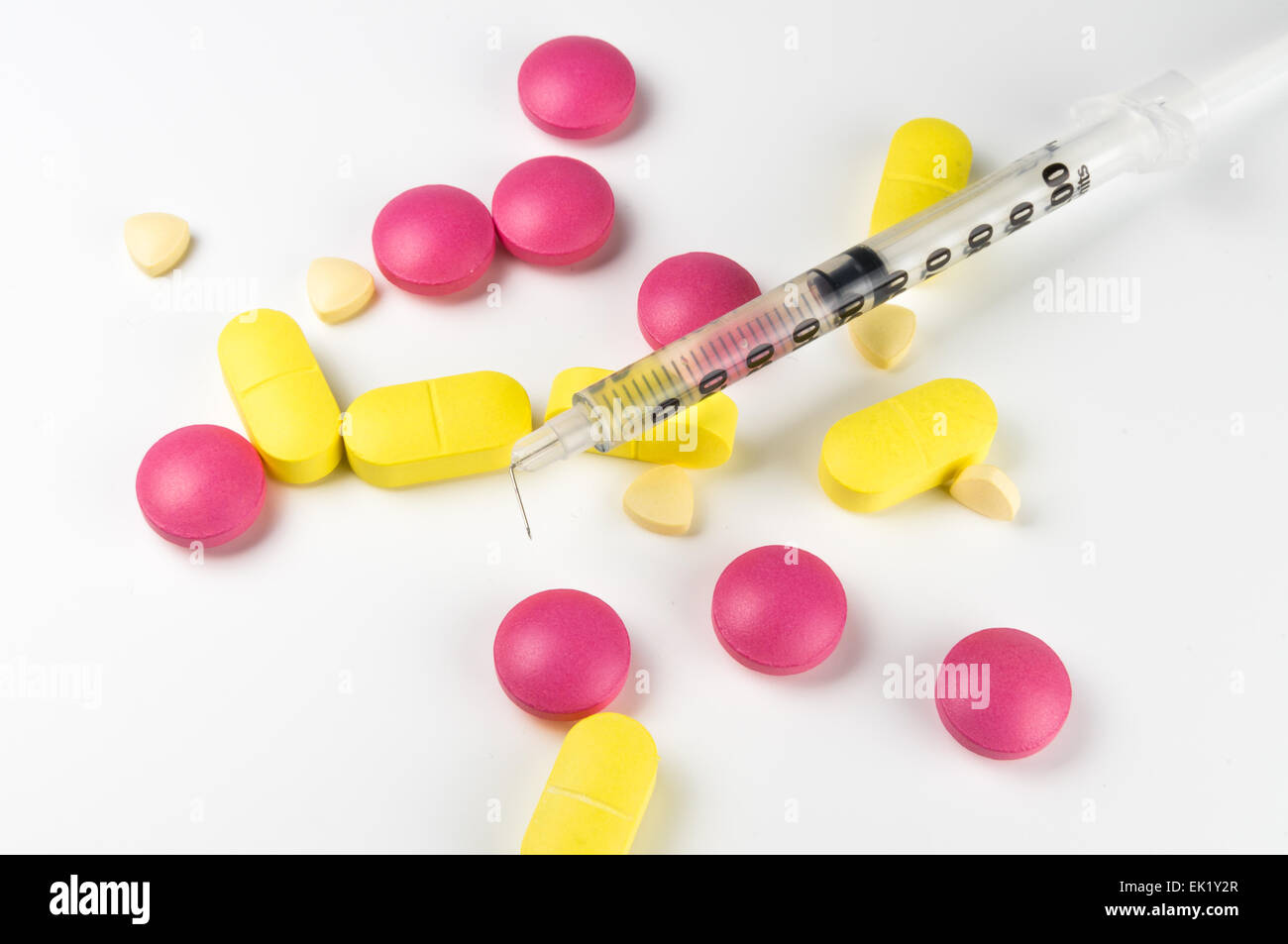 Pills And Syringe On Pink Background High Resolution Stock Photography ...