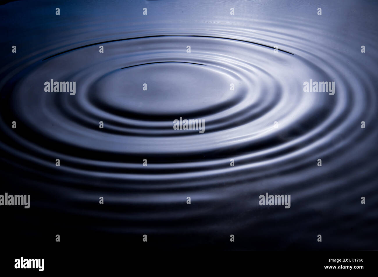 Drop of water splashing on surface Stock Photo - Alamy