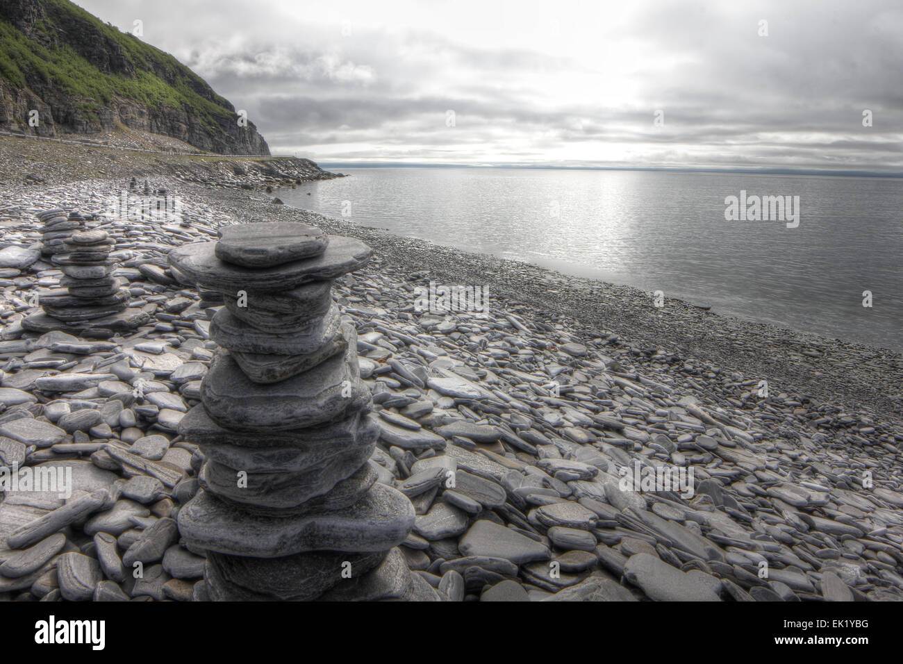 Stack of stones on northern Norway fjord background Stock Photo - Alamy
