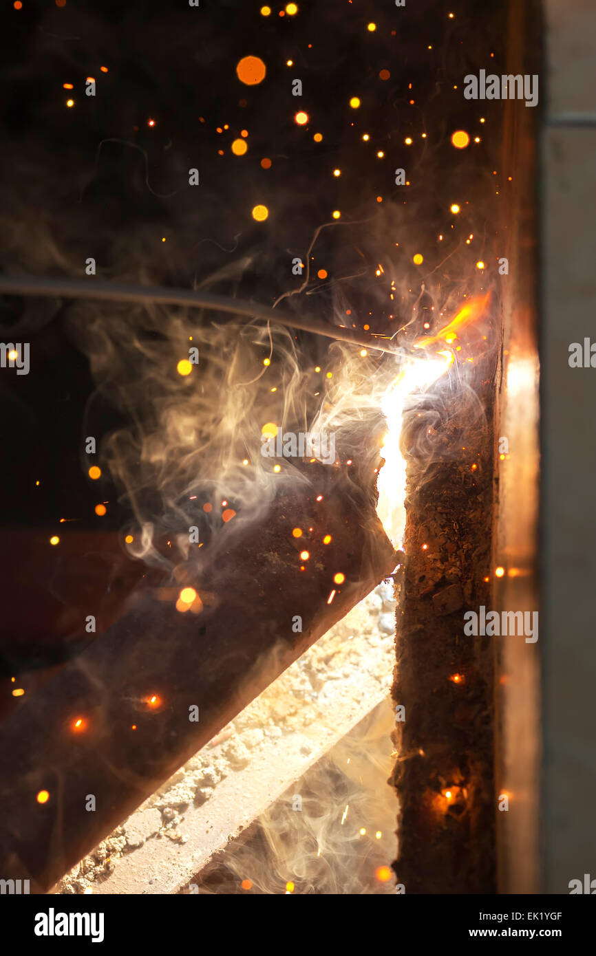 welding steel with spread spark lighting smoke Stock Photo - Alamy
