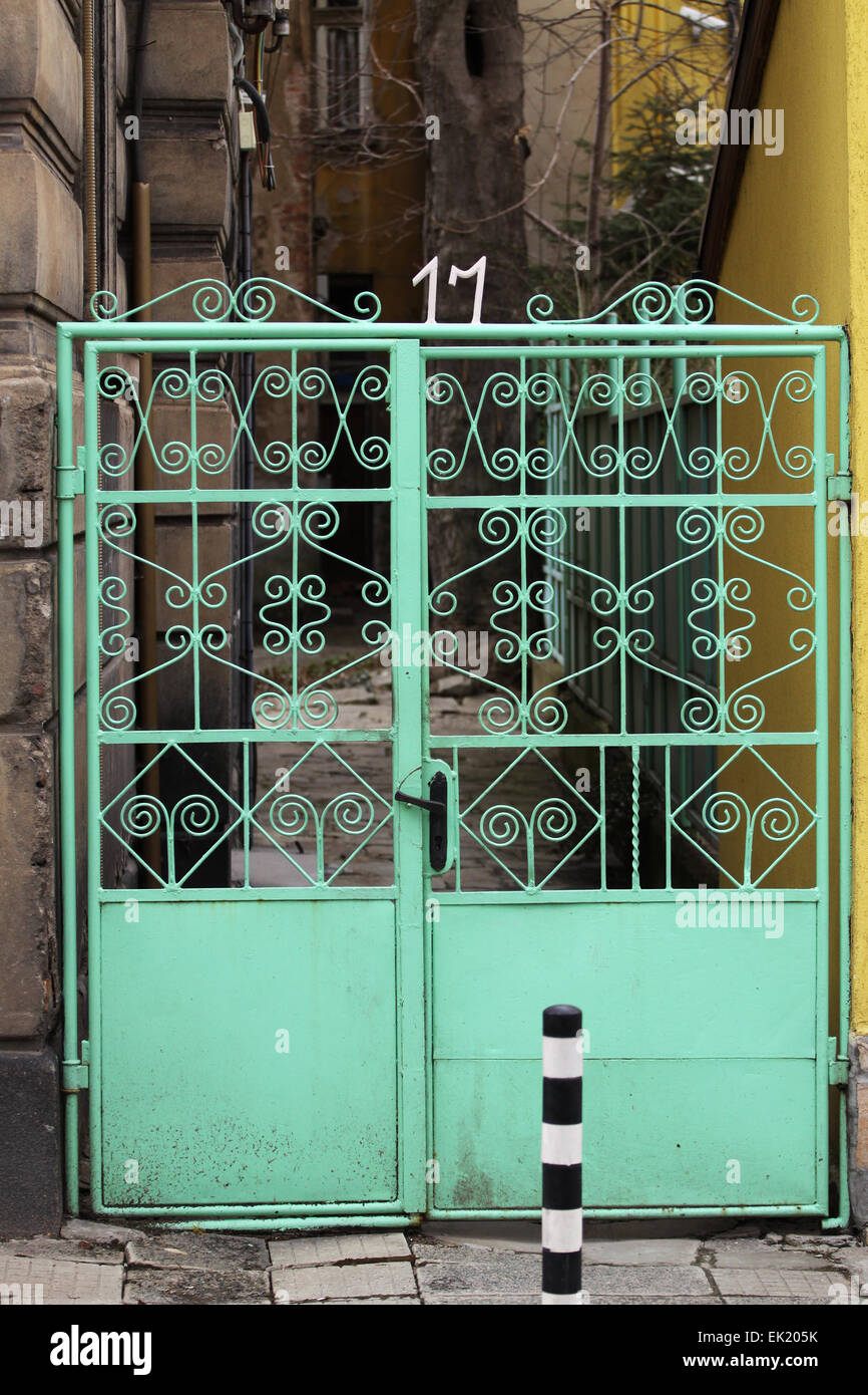 Old metal gate and security closed entrance door Stock Photo - Alamy