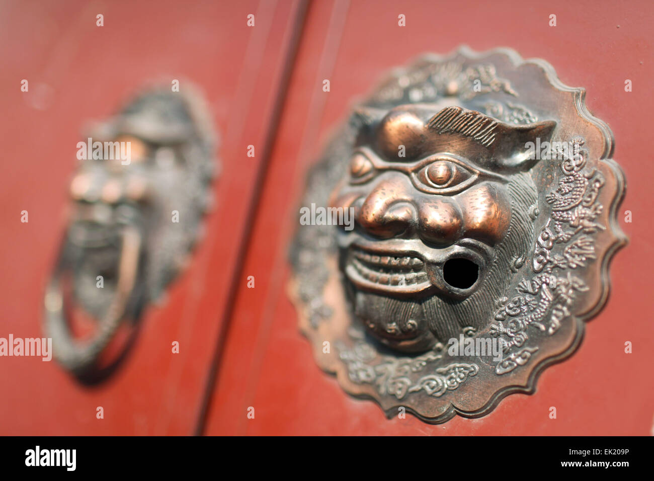 Beijing, China. 7th Apr, 2012. Historic door knockers on a court gate ...