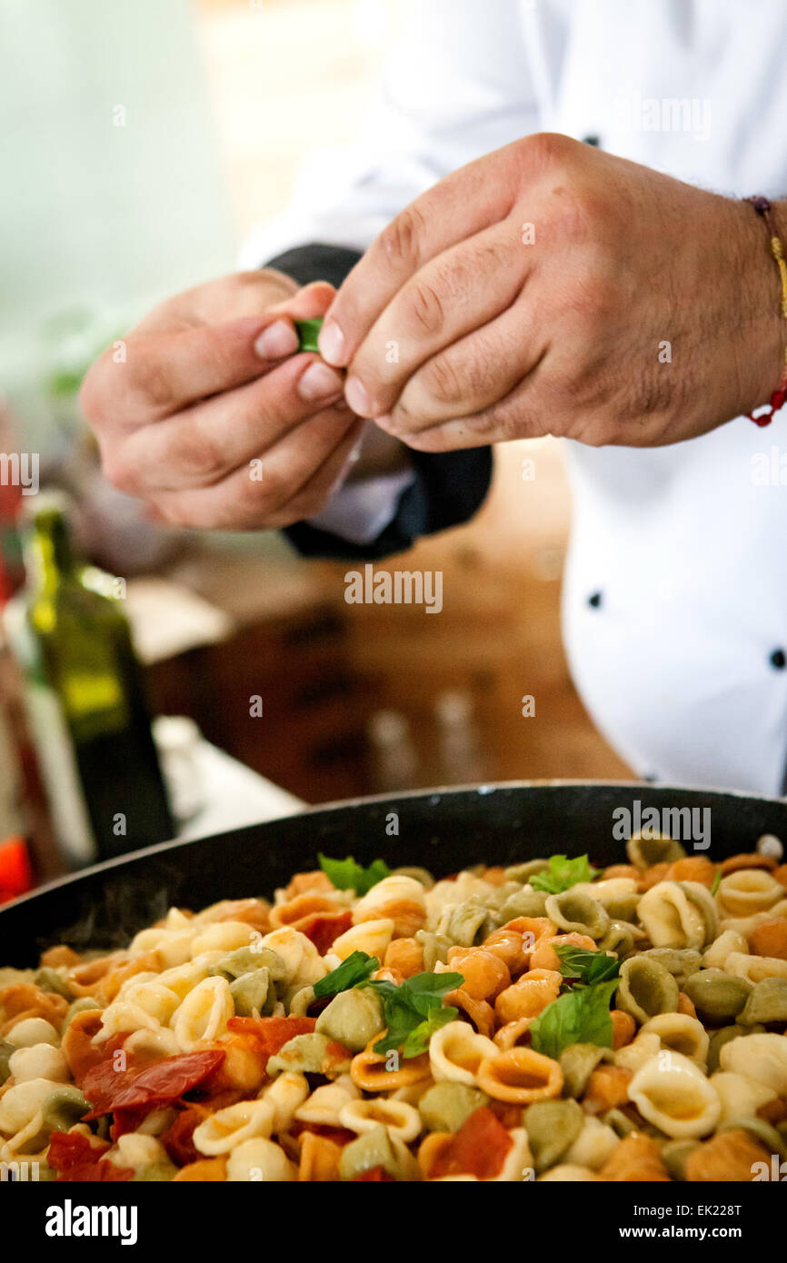 Hand made Orecchiette or 'little ears' pasta in a rustic tomato sauce ...