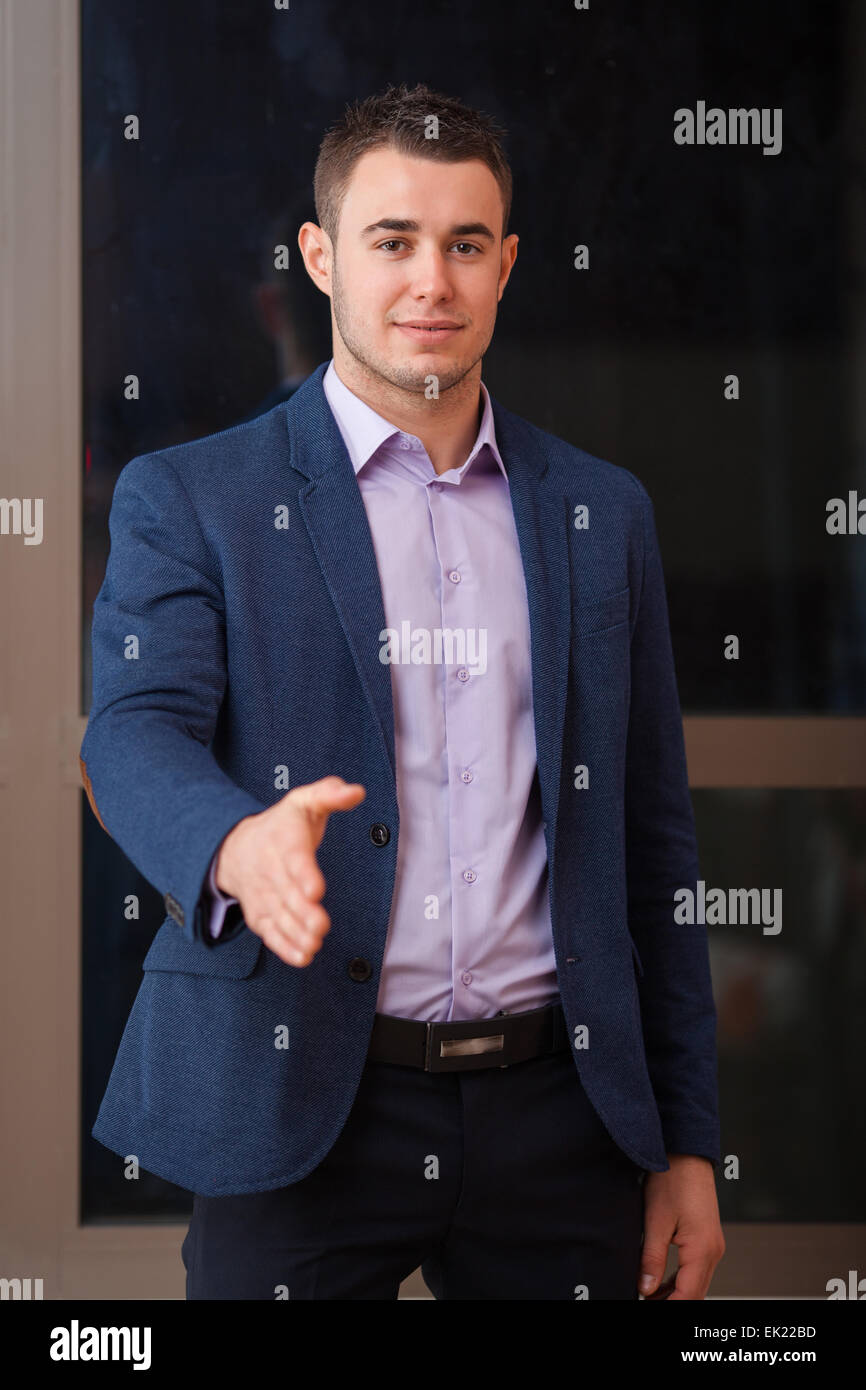 Man shows hand sign Stock Photo - Alamy