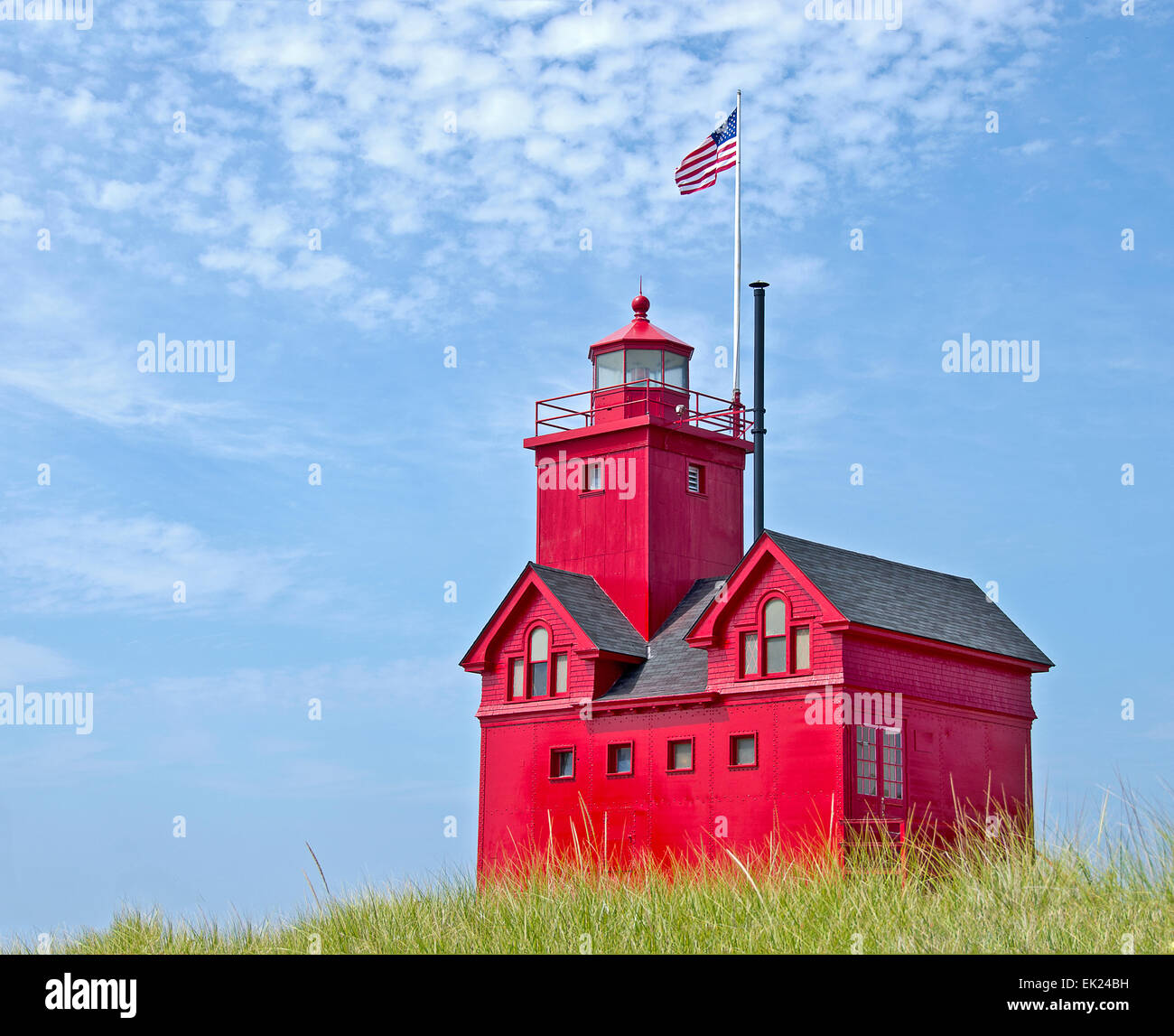 Big Red lighthouse in dune grass in Holland, Michigan Stock Photo - Alamy