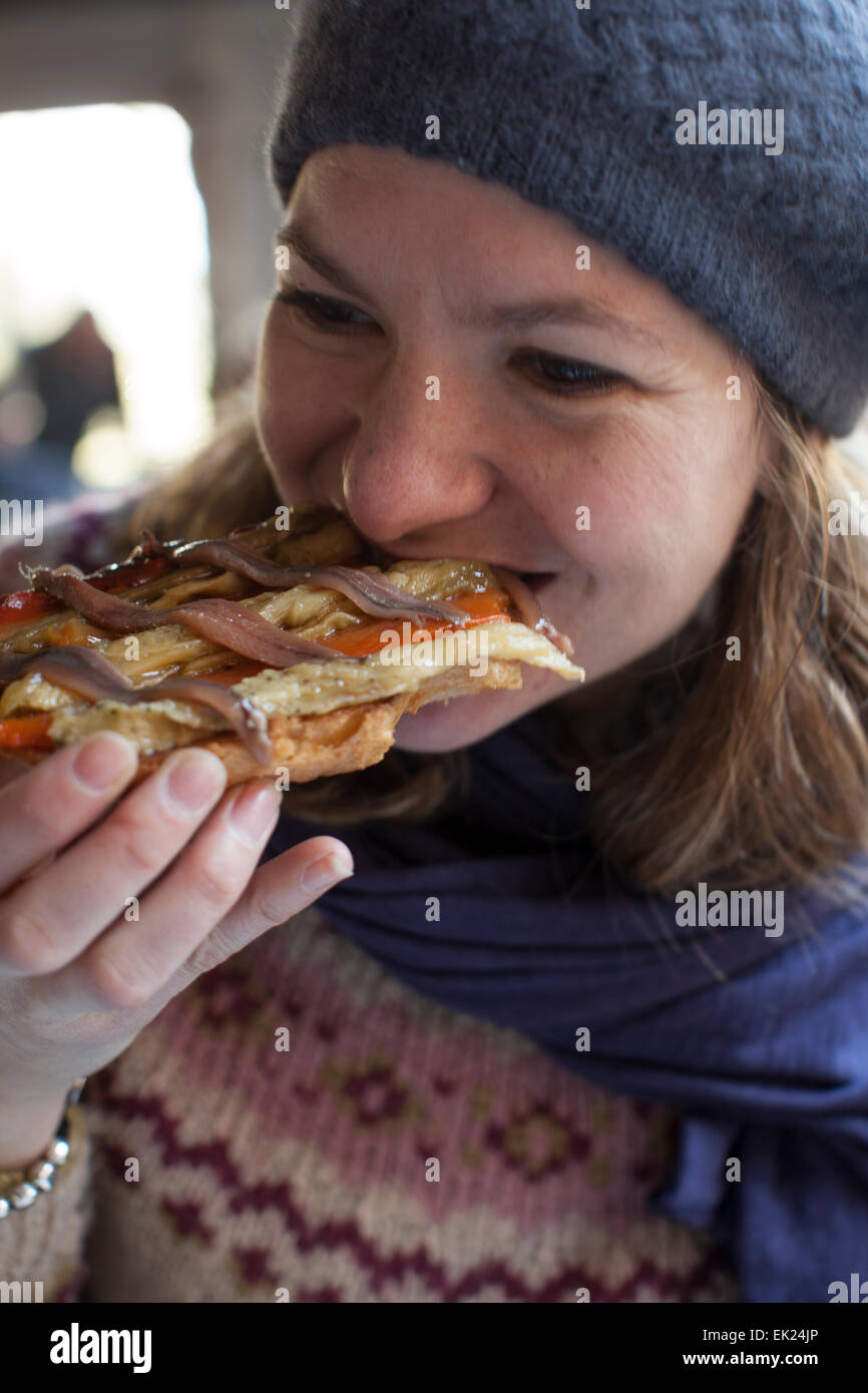 Young woman enjoying traditional food in Catalonia, Spain Stock Photo ...