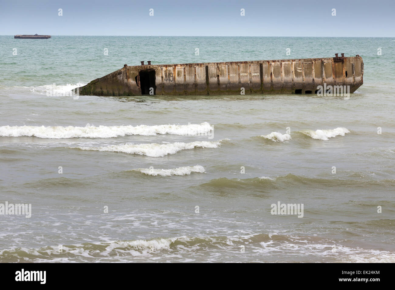 Arromanches les Bains beach with the remains of the Mulberry harbour in ...