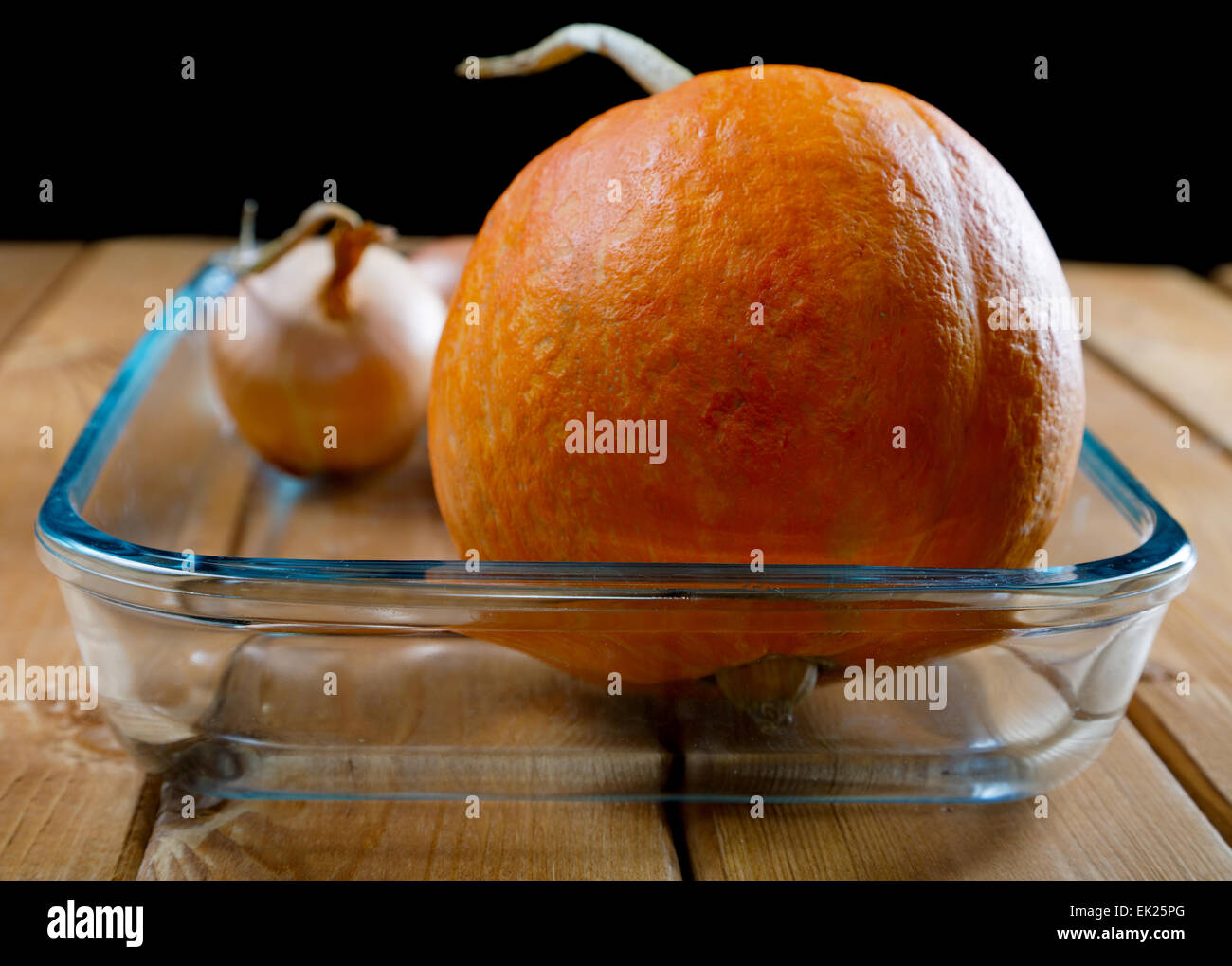 Small pumpkin and onions in a glass plate Stock Photo - Alamy