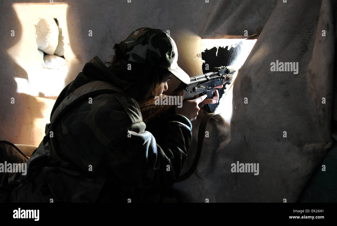 Damascus, Syria. 5th Apr, 2015. A female sniper takes positon in a ...