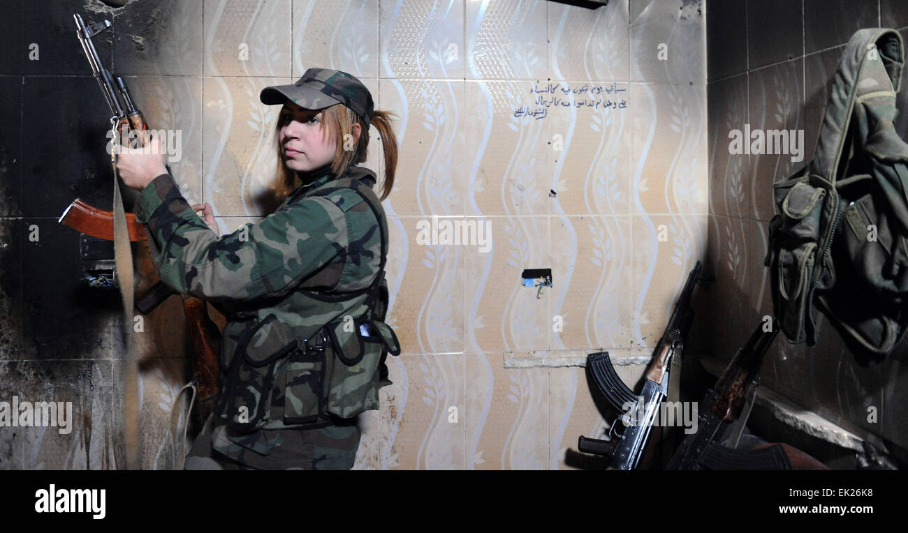 Damascus, Syria. 5th Apr, 2015. A female sniper takes positon in a ...