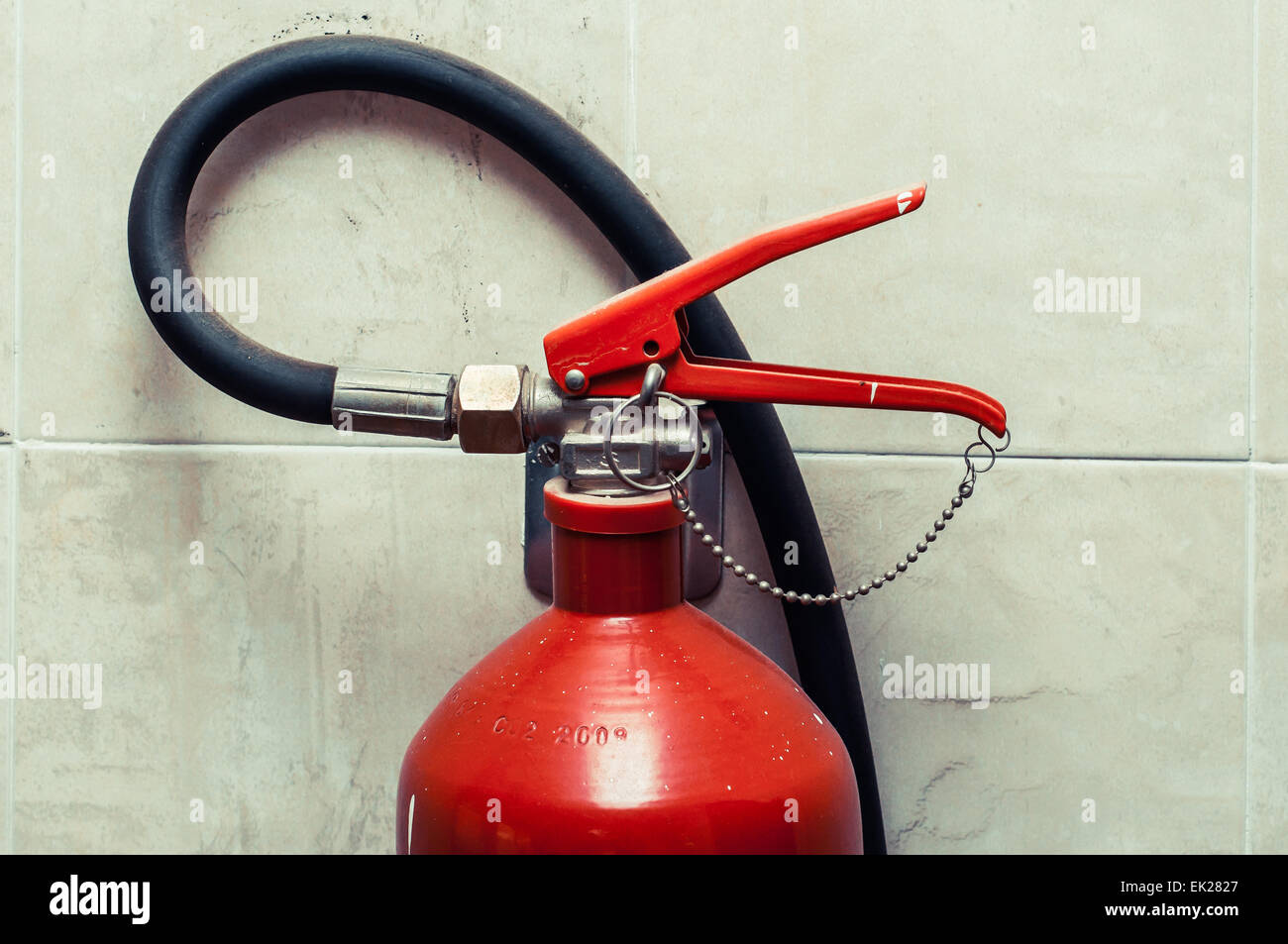 Trigger fire extinguisher Stock Photo - Alamy