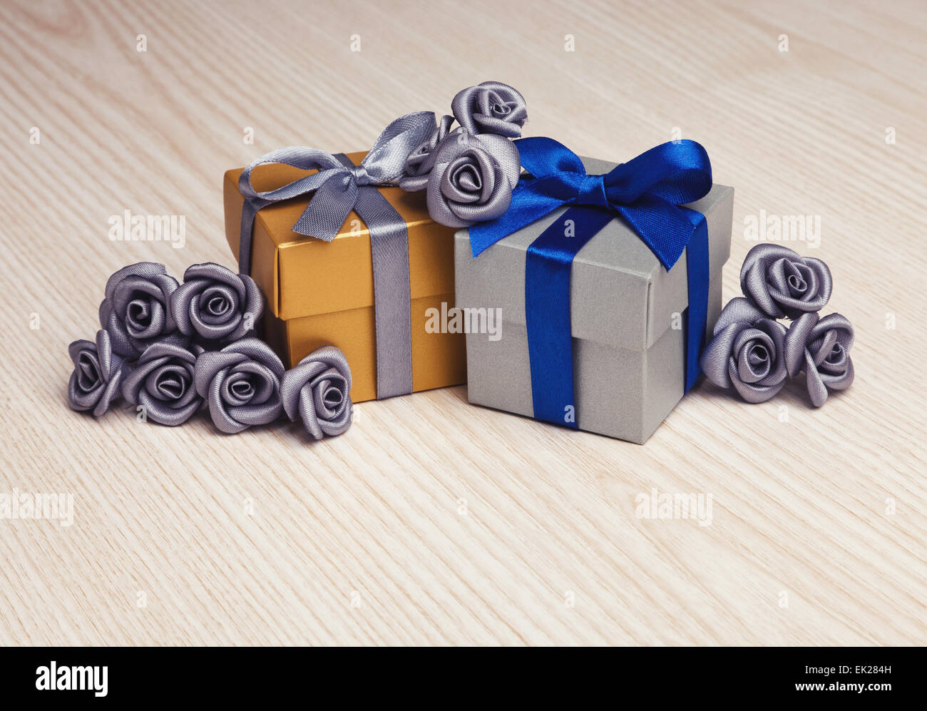 grey flowers and two gift boxes Stock Photo - Alamy