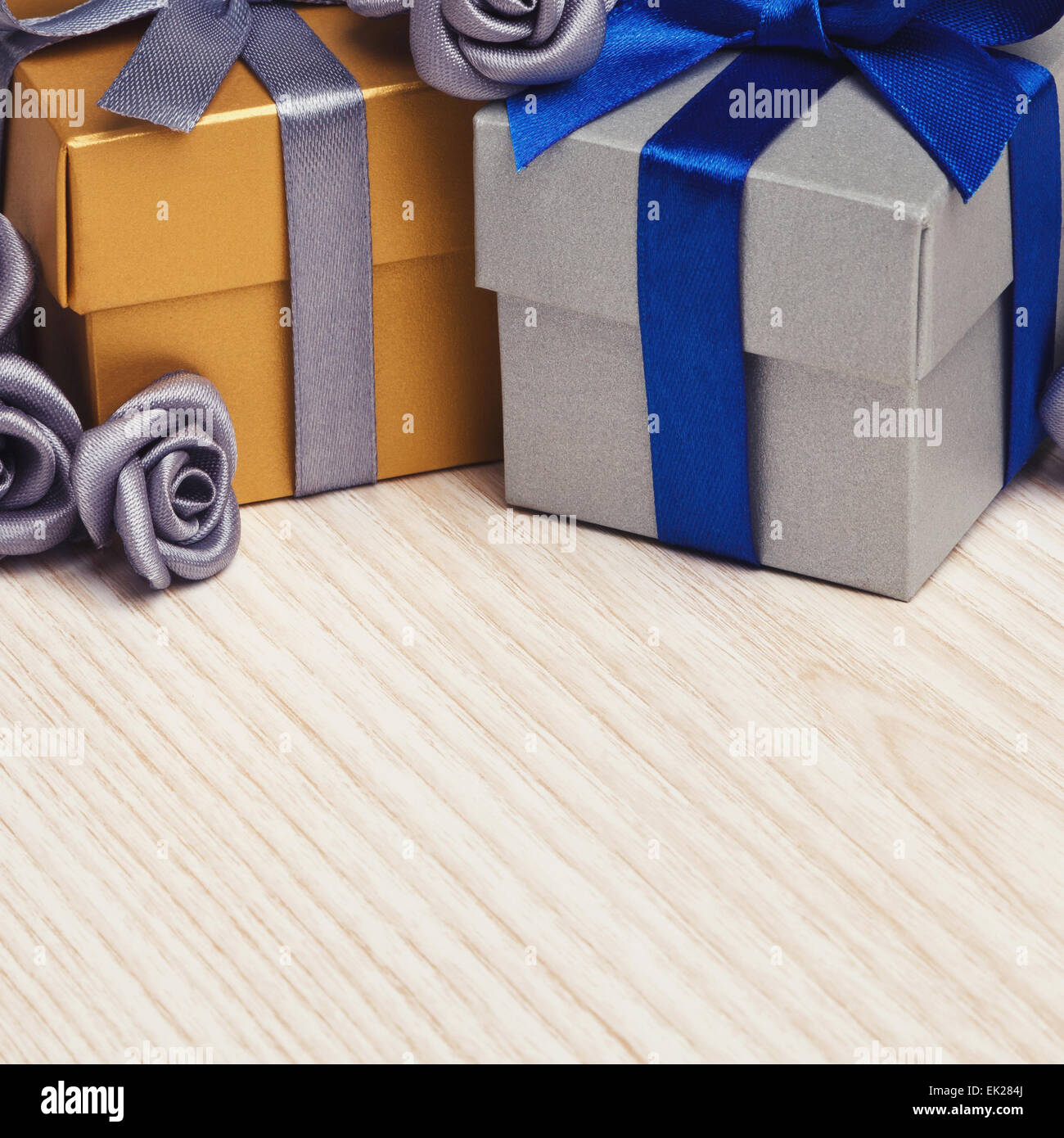 grey flowers and two gift boxes Stock Photo - Alamy