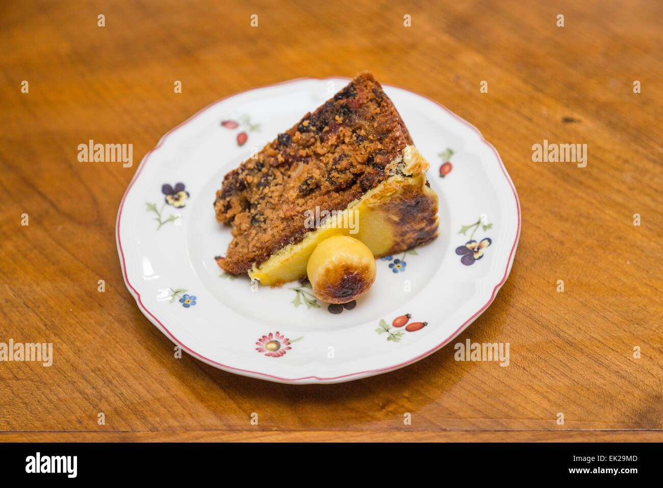 Slice of traditional Easter simnel cake, a fruit cale with marzipan ...