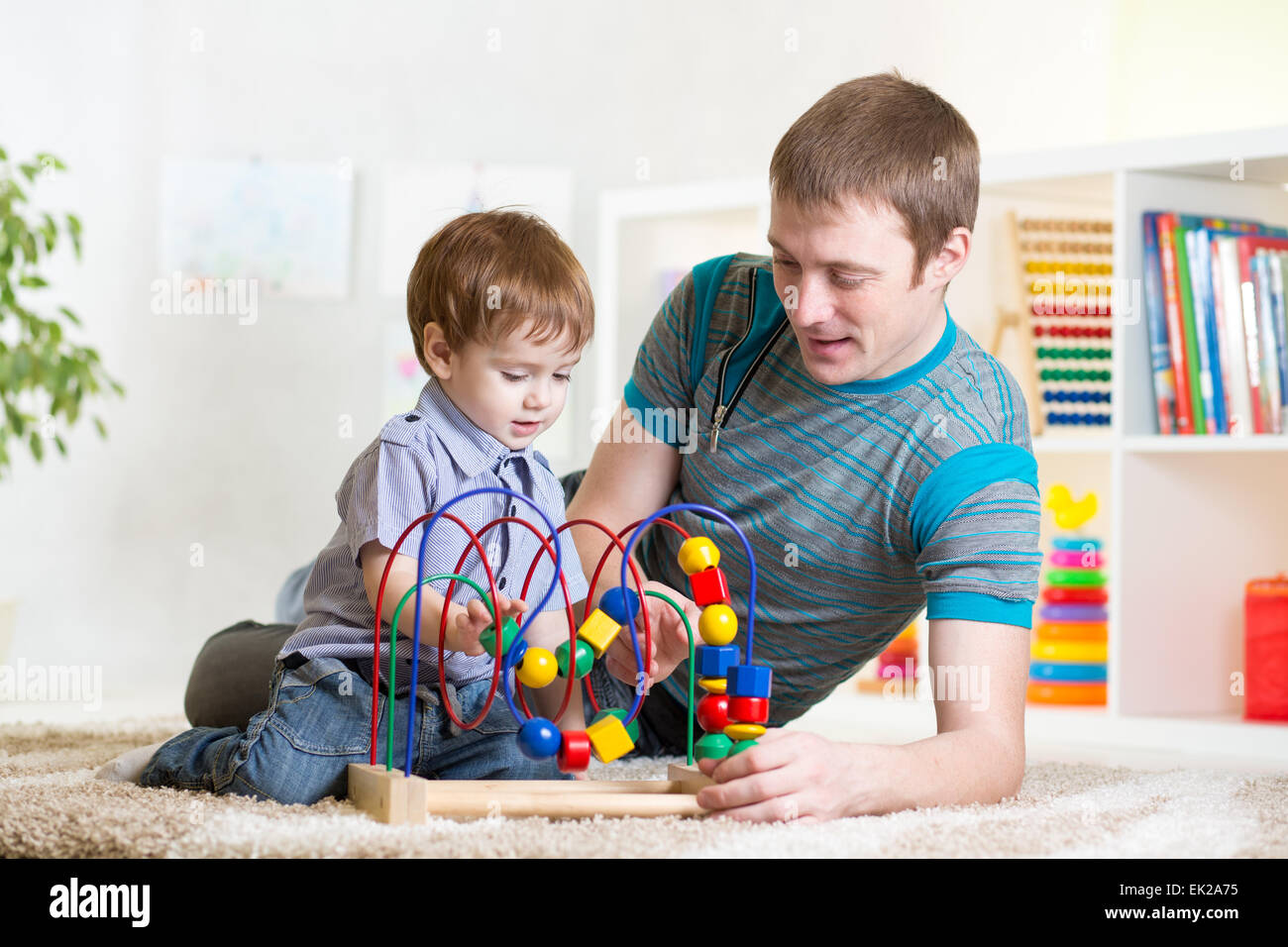 happy kid boy and dad playing toy Stock Photo - Alamy
