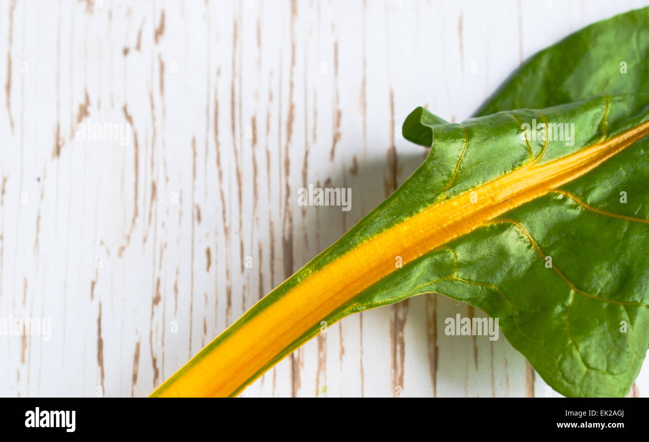 Rainbow Chard close up on wooden surface Stock Photo - Alamy