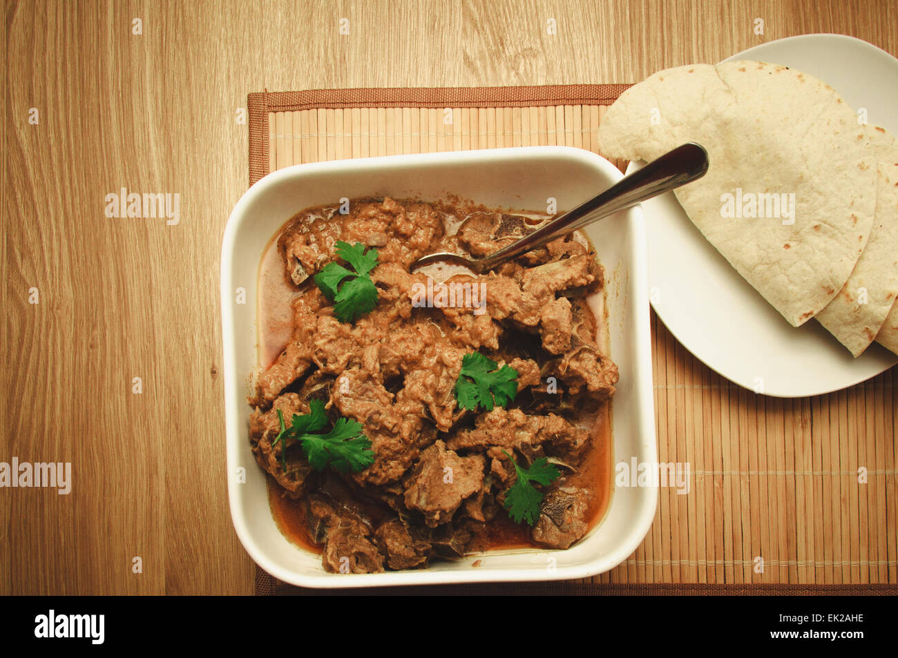 Lamb mutton Korma on a wooden background Stock Photo - Alamy
