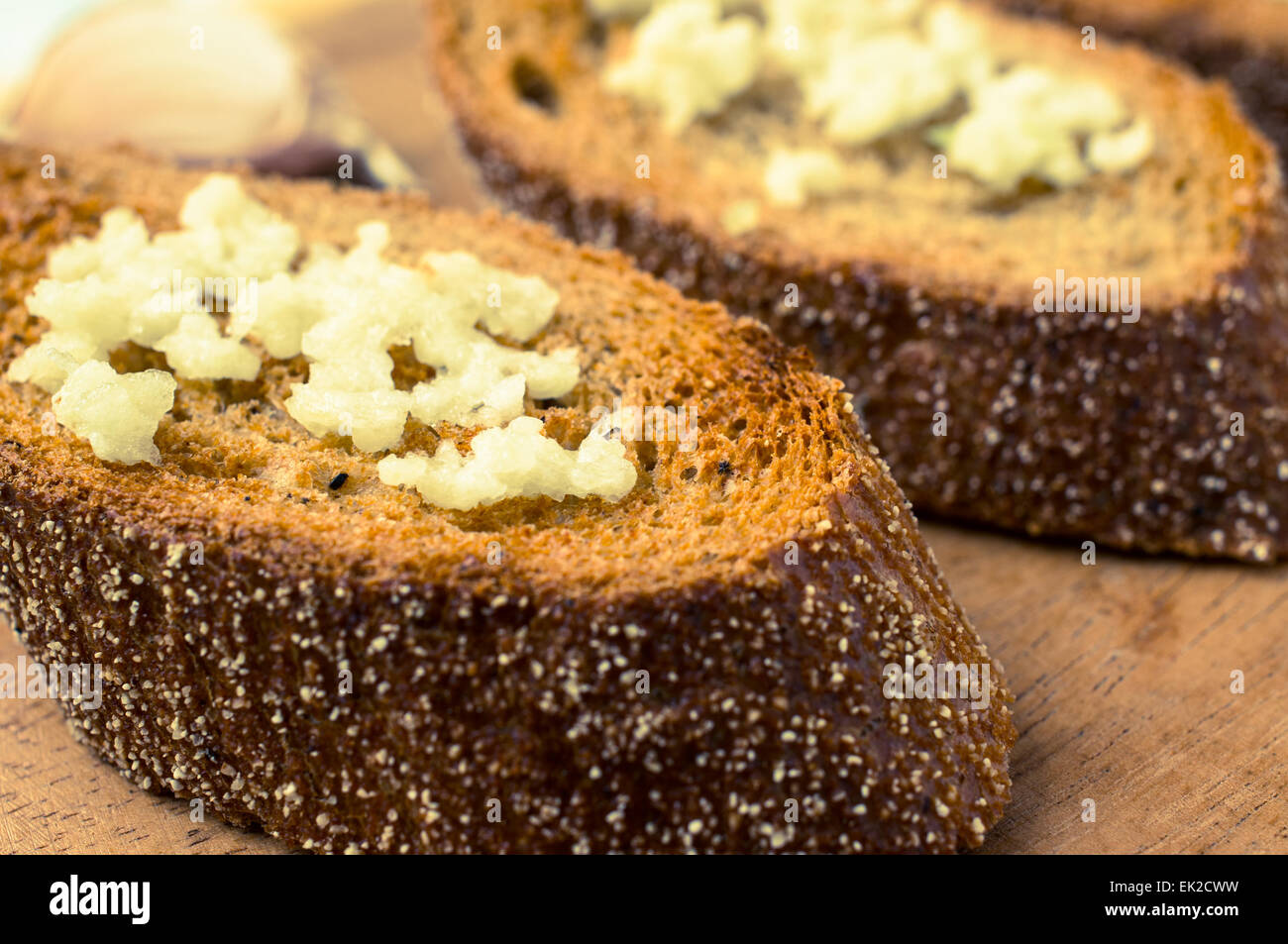 Tapas, two slices of bread with garlic grated Stock Photo - Alamy
