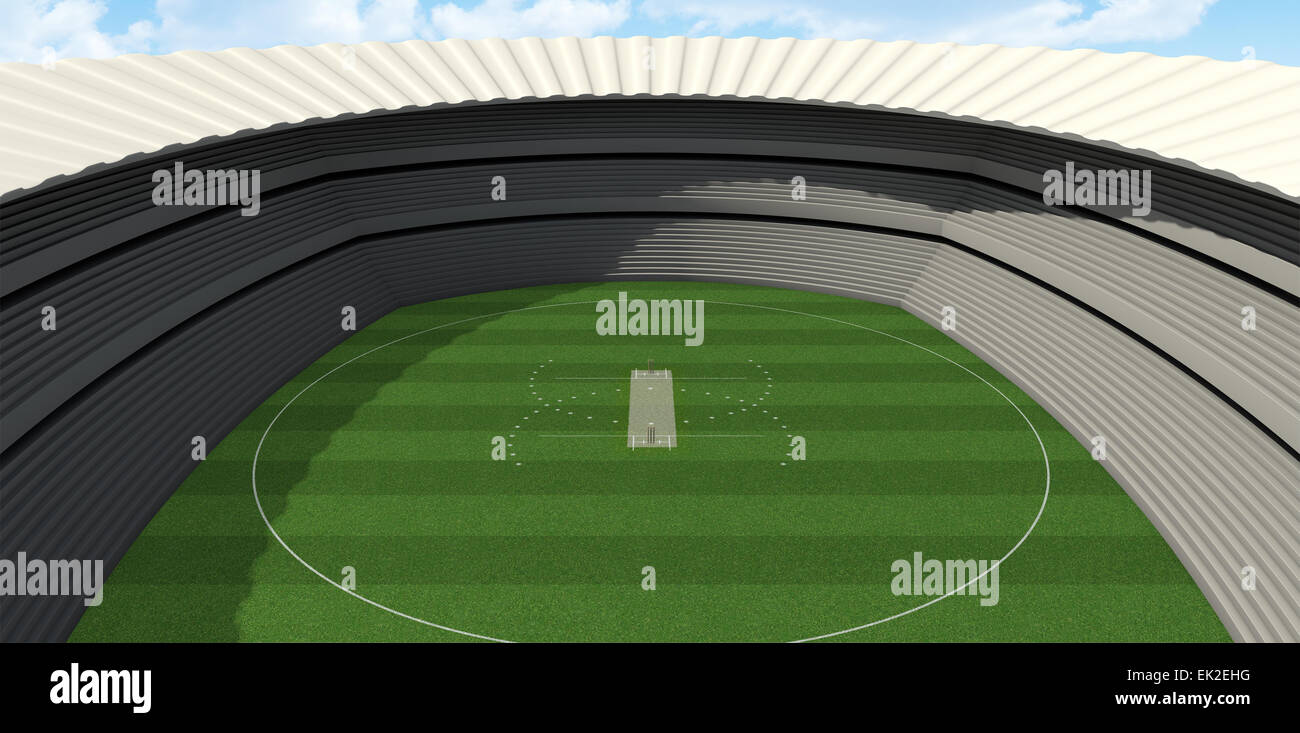 A cricket stadium with a pitch on a marked green grass field in the ...