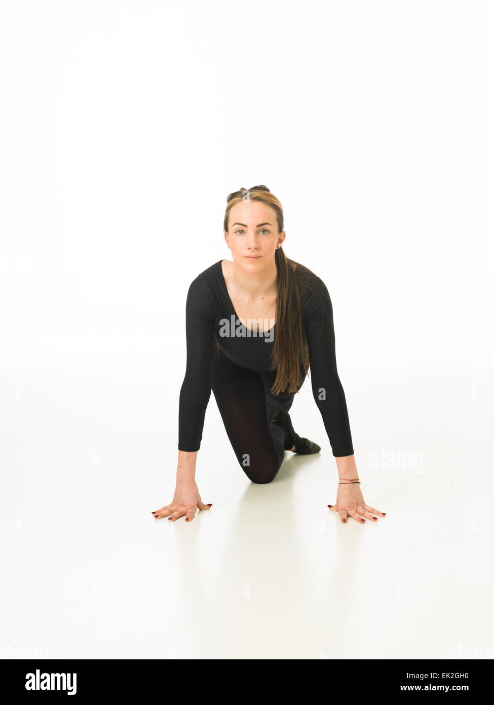 beautiful ballet dancer sitting on studio floor looking in front of the ...