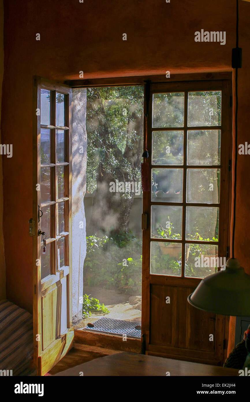 View from inside through open door with sunlight filtering in Stock ...