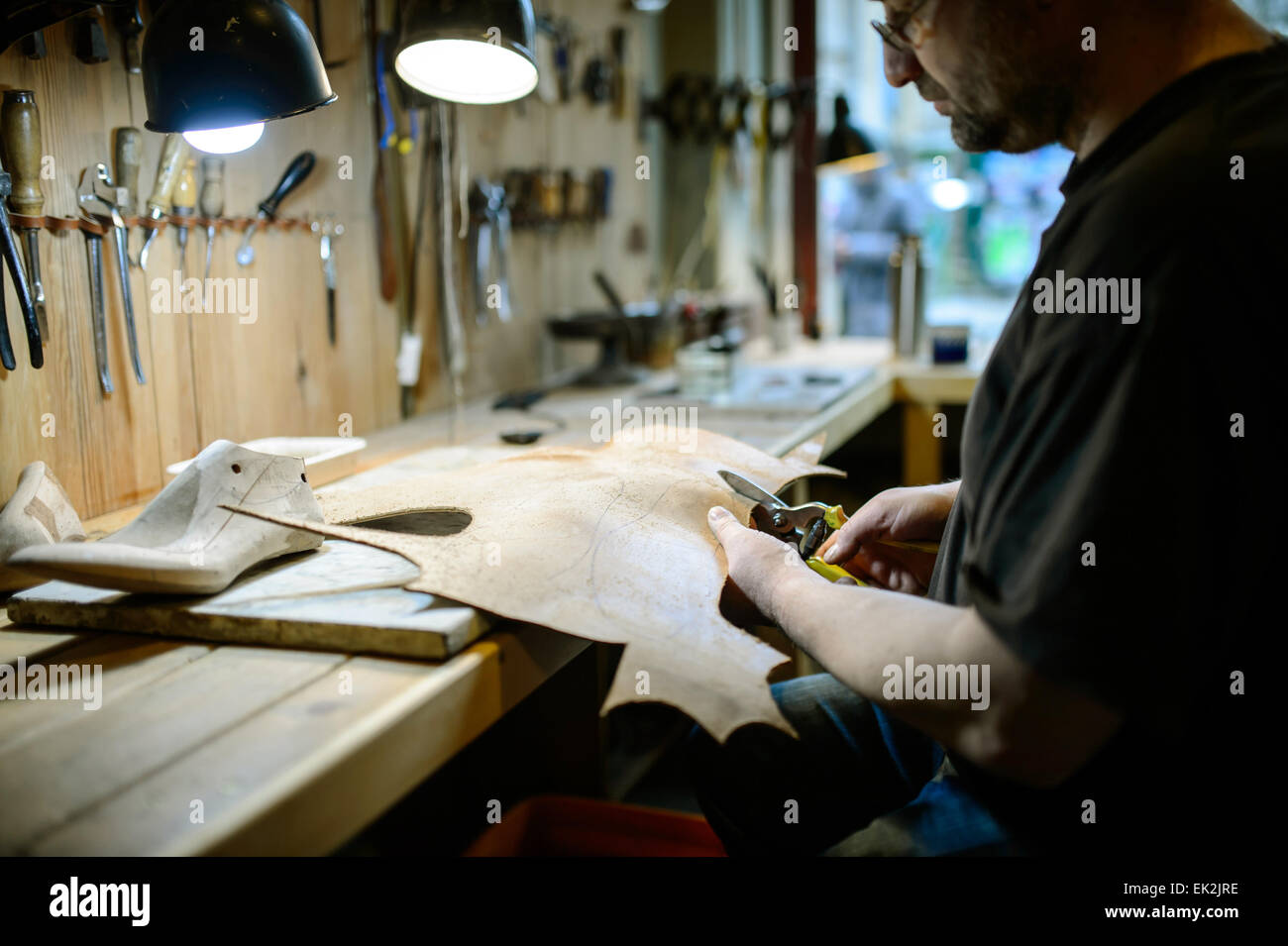 Dresden, Germany. 12th Mar, 2015. Shoemaker Alexander Preiss works on a ...
