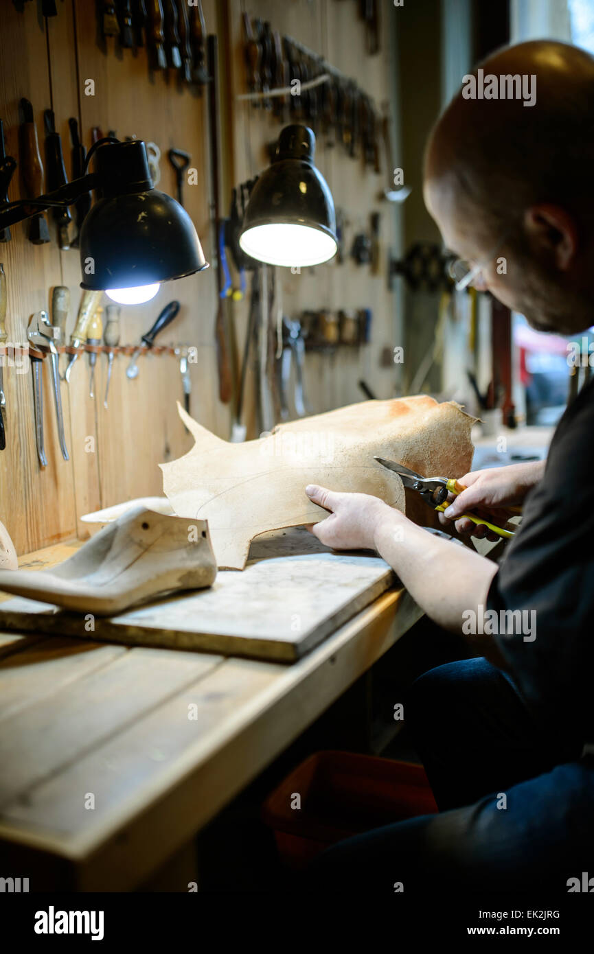 Dresden, Germany. 12th Mar, 2015. Shoemaker Alexander Preiss works on a ...