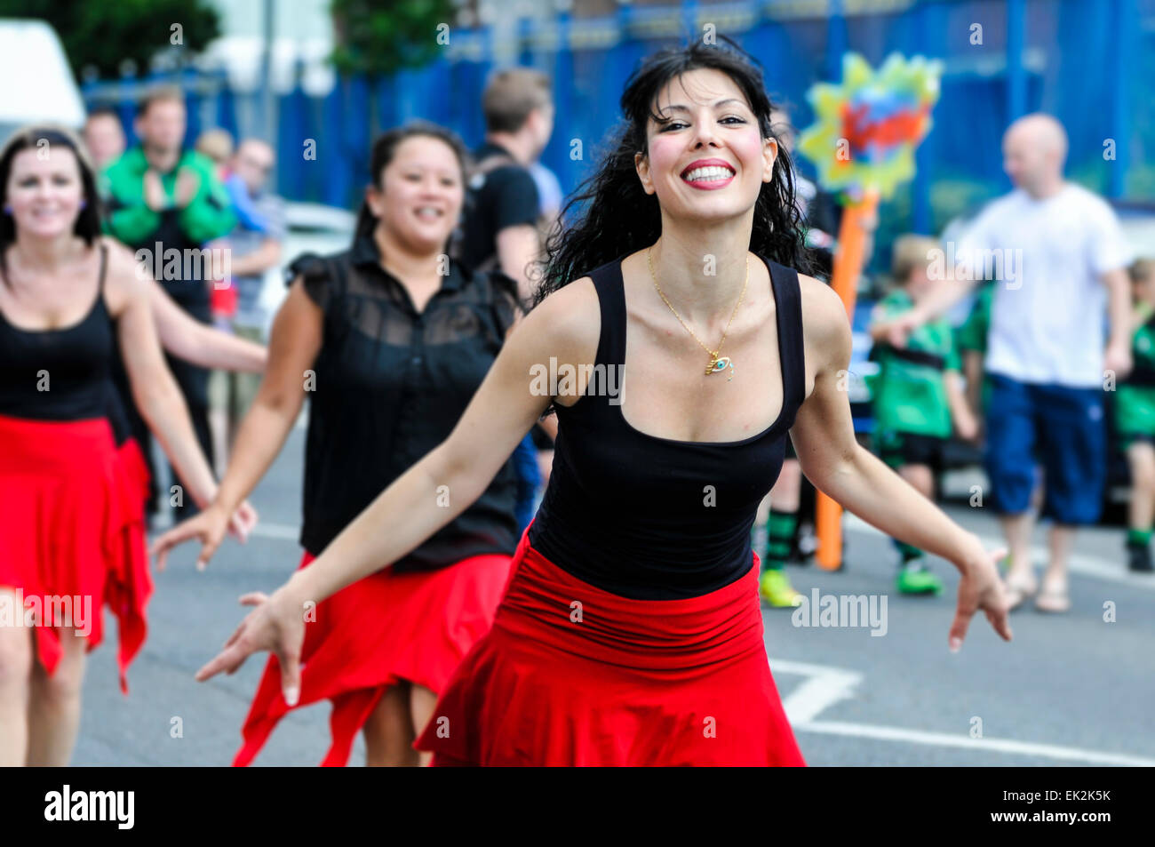 Dancers taking part in a street parade at the start of a festival Stock ...