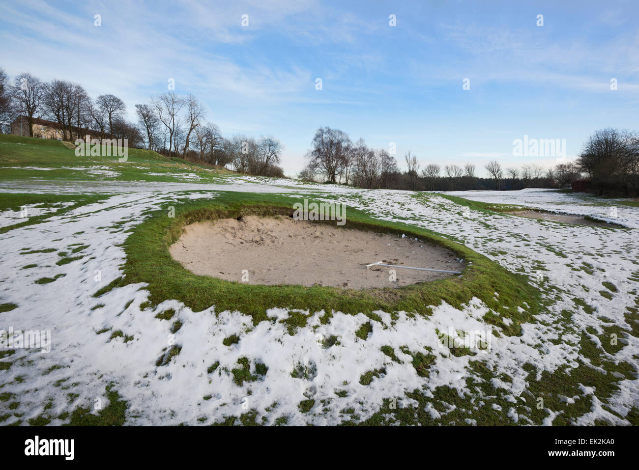 Golf Course bunker surrounded by snow and footprints Stock Photo - Alamy