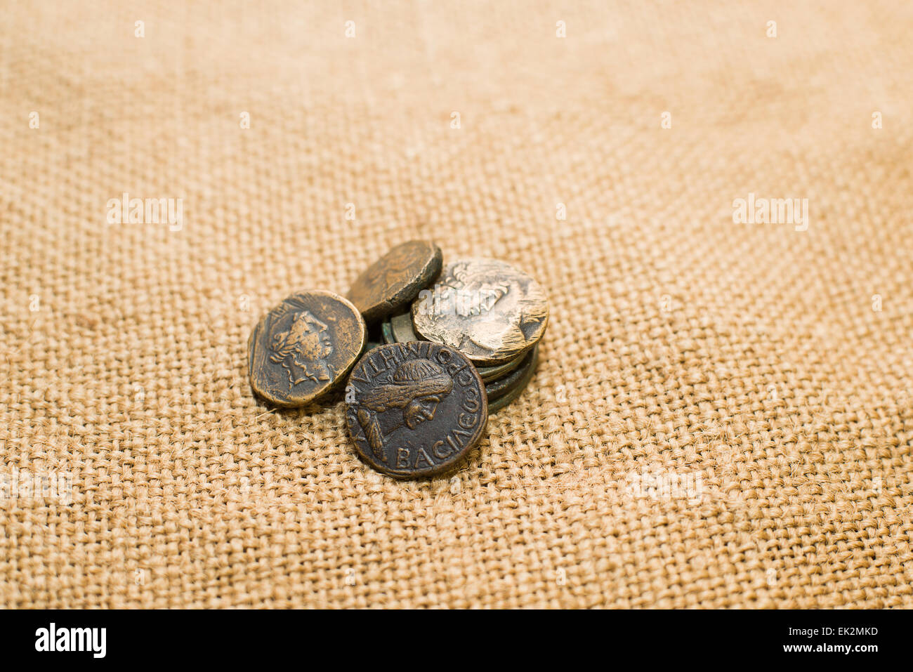 Antique bronze coins with portraits of emperors on old cloth Stock ...