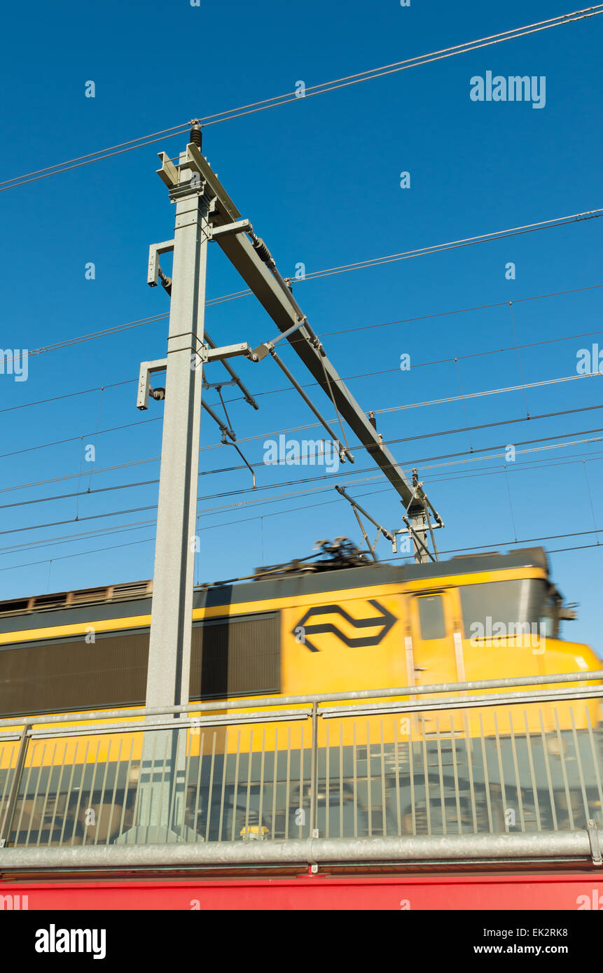 train passing by a railway catenary Stock Photo - Alamy