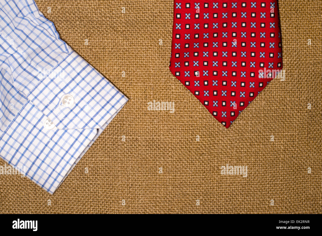 Red tie and plaid shirt on the old sacking Stock Photo - Alamy