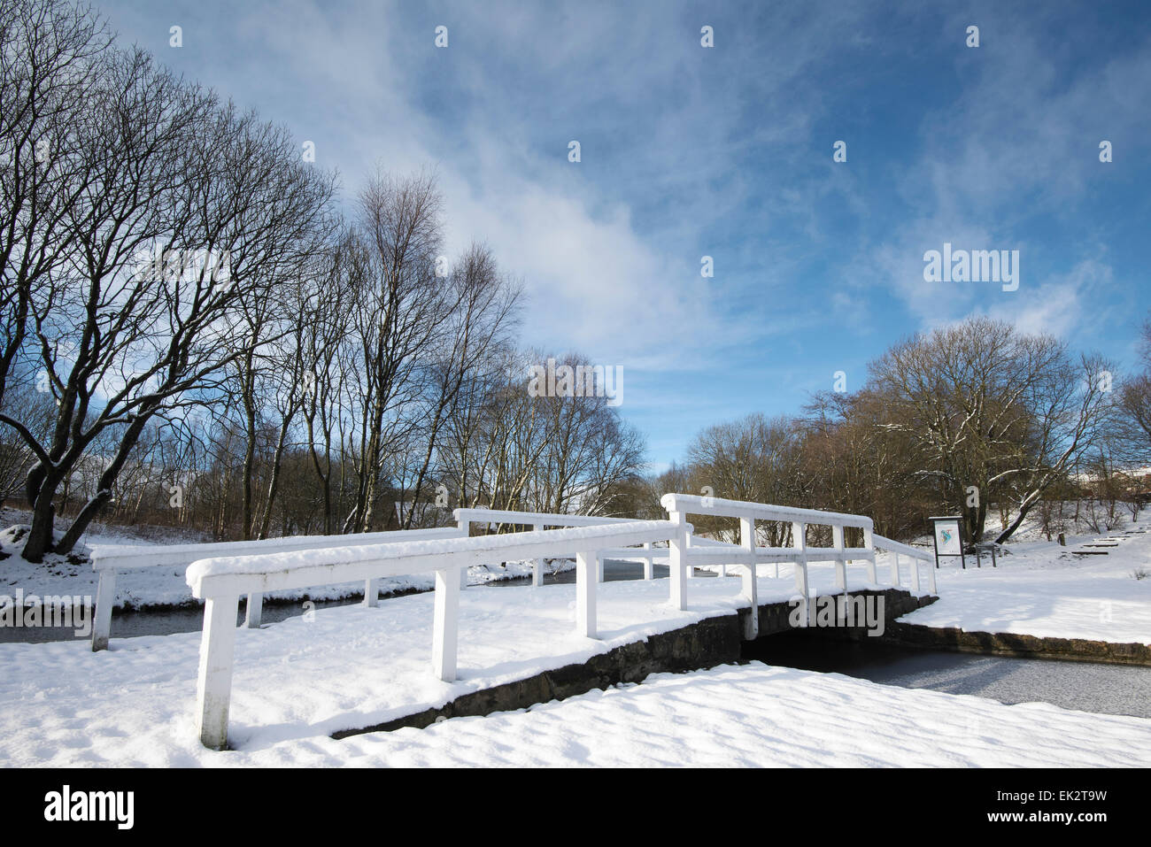 Snow covered bridge over canal Stock Photo - Alamy
