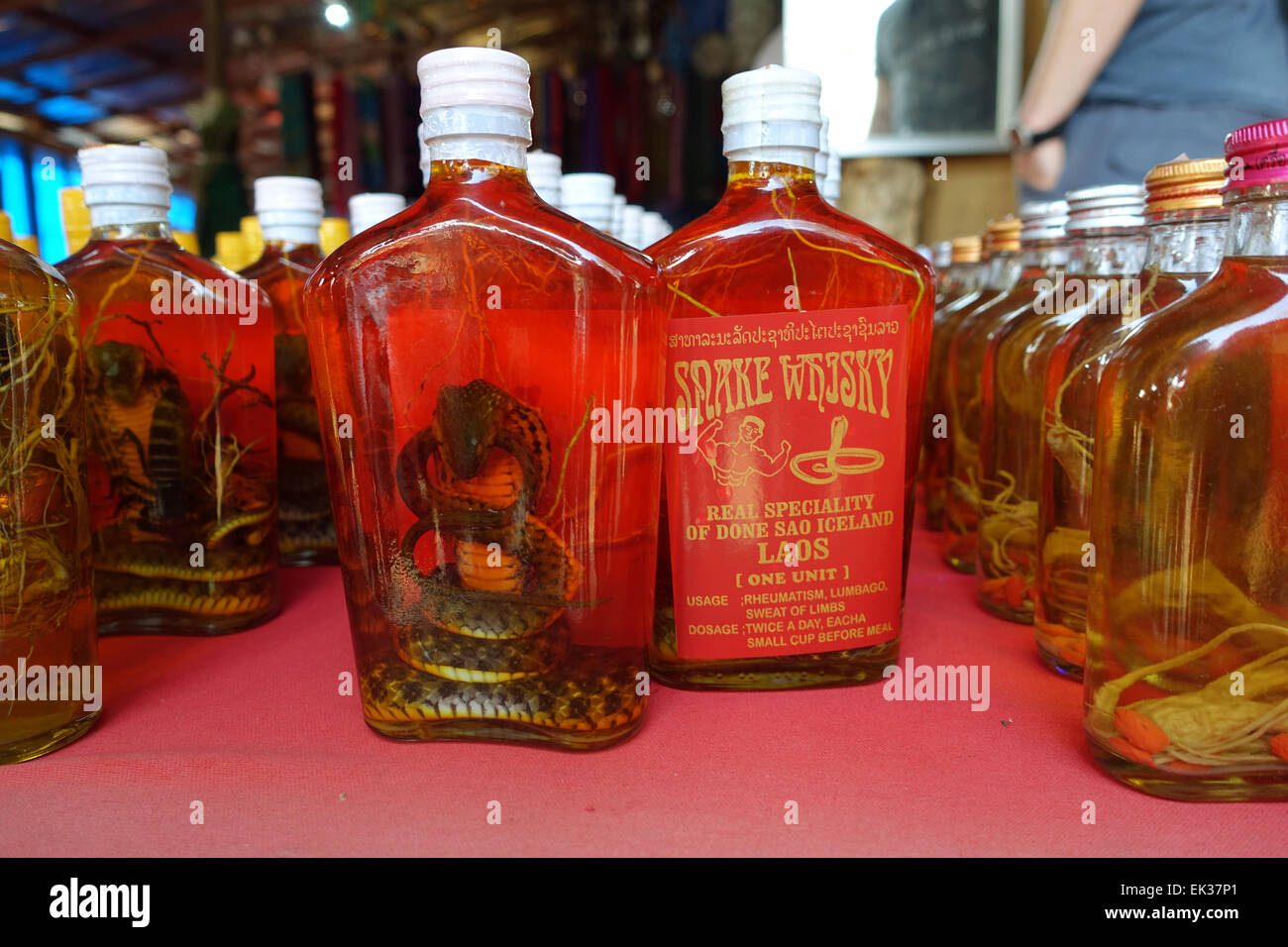 Whisky bottles with snakes are sold in a market in Don Sao, Laos, 25 ...