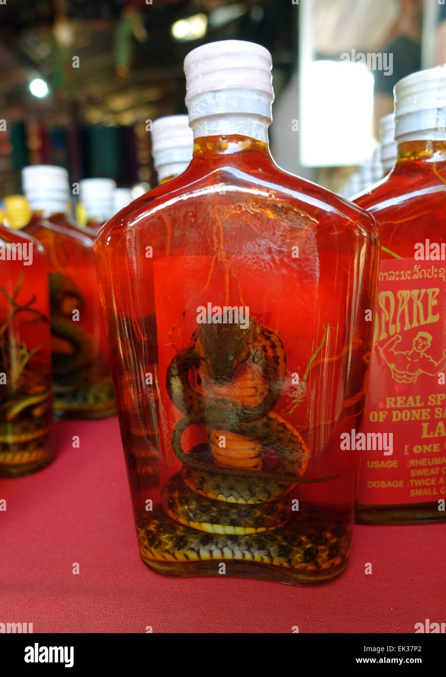 Whisky bottles with snakes are sold in a market in Don Sao, Laos, 25 ...