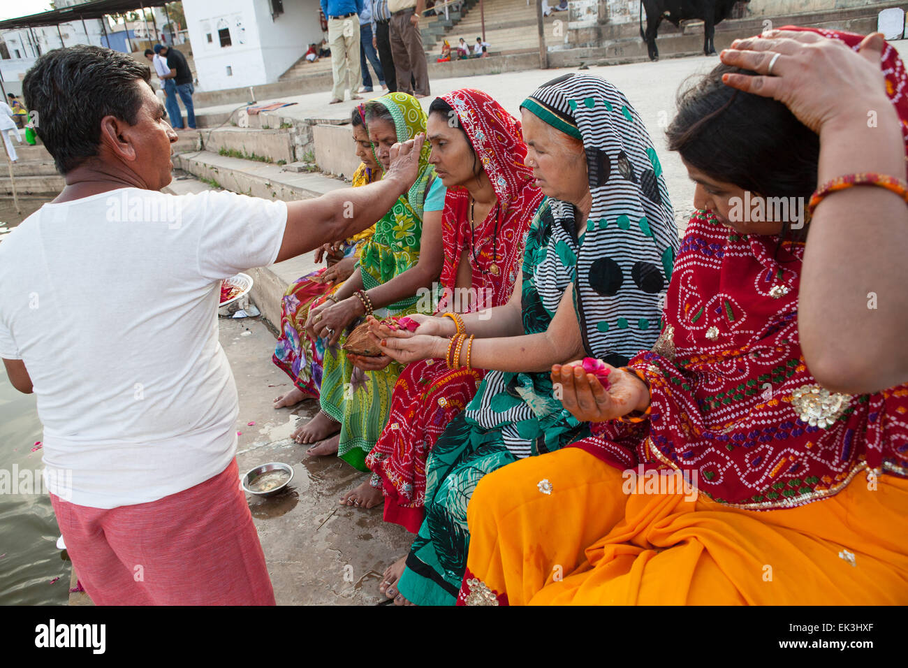 A Pandit (holy man and priest who performs ceremonies) conducts puja ...