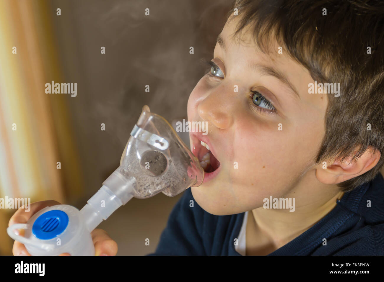 child taking respiratory, inhalation therapy Stock Photo - Alamy