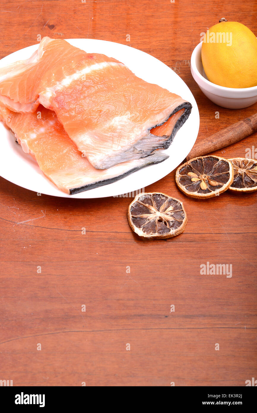 Slice of red fish salmon with fruits and cinnamon Stock Photo - Alamy