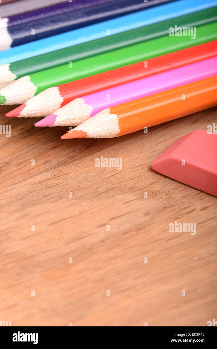 pencil set on wooden plate with eraser Stock Photo - Alamy