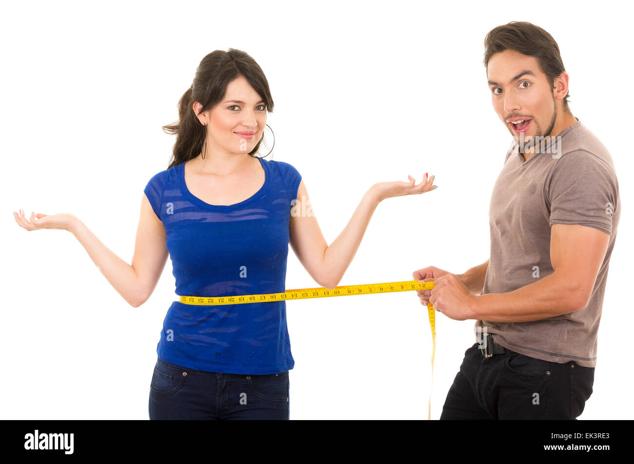 handsome man holding measuring tape around thin young girl Stock Photo ...
