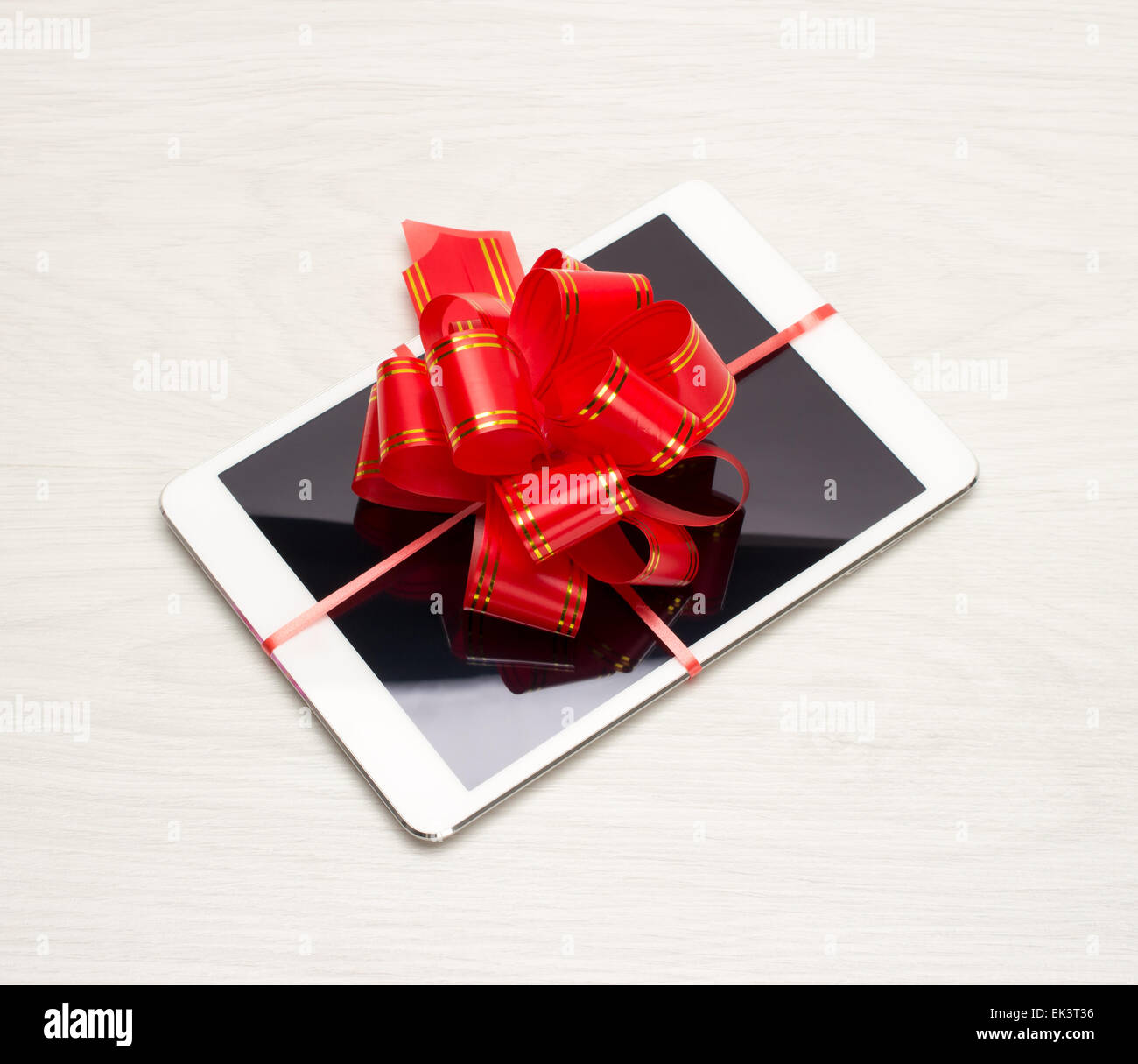 Gift for the holidays tablet with a bow Stock Photo - Alamy