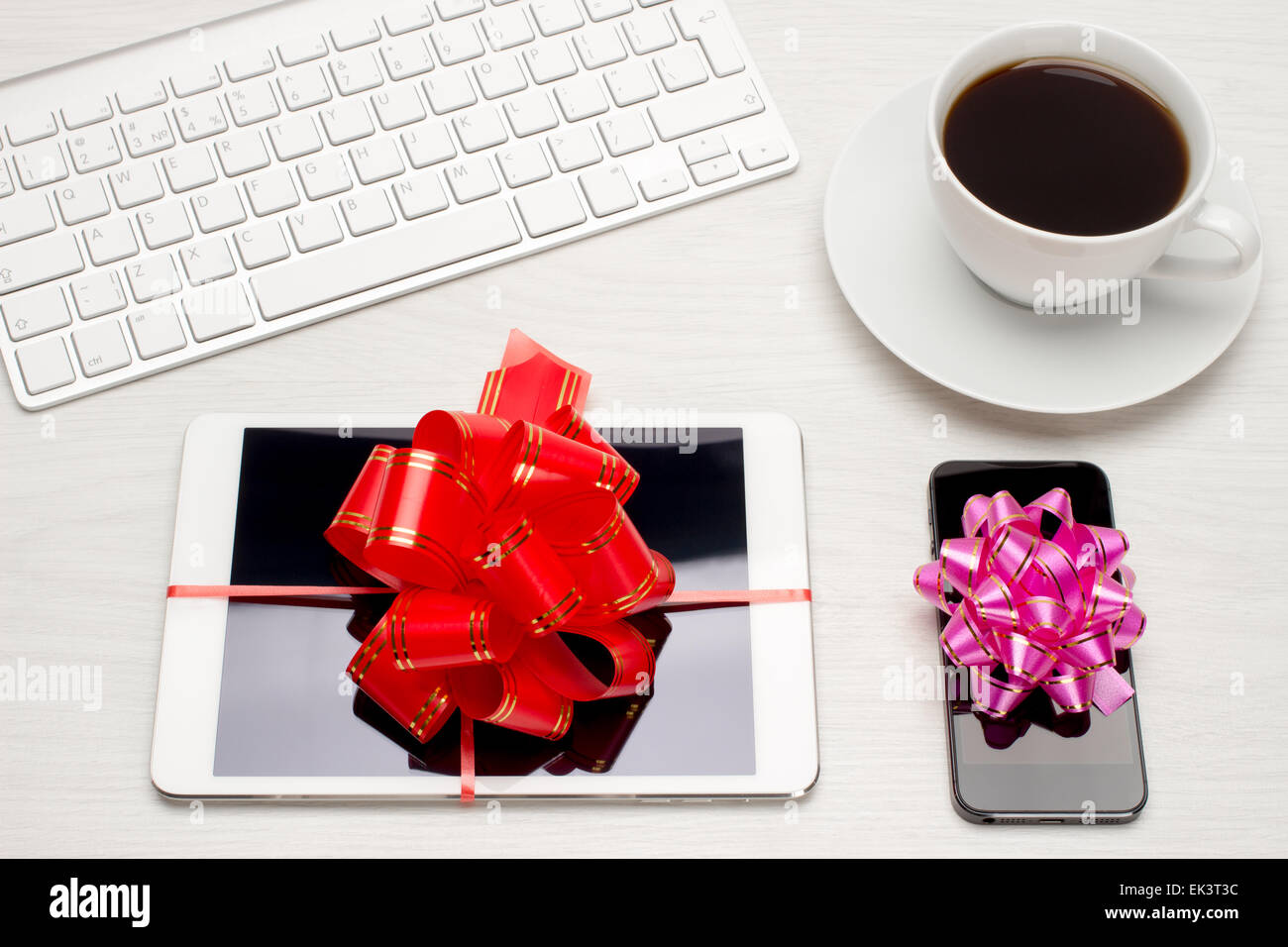 Gift for the holidays tablet with a bow Stock Photo - Alamy