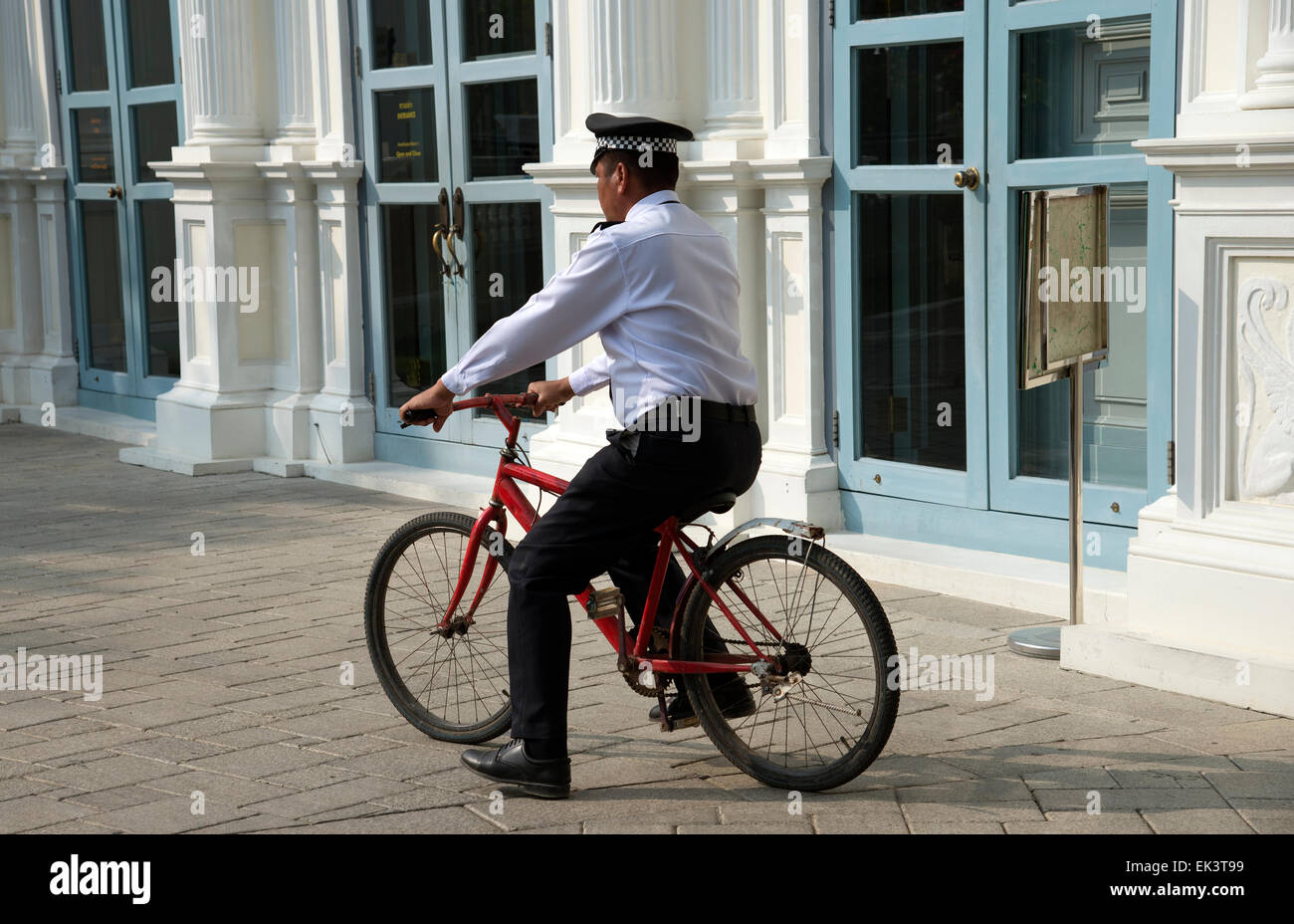 Security guard riding a bicycle that has no brakes The cycle is being ...