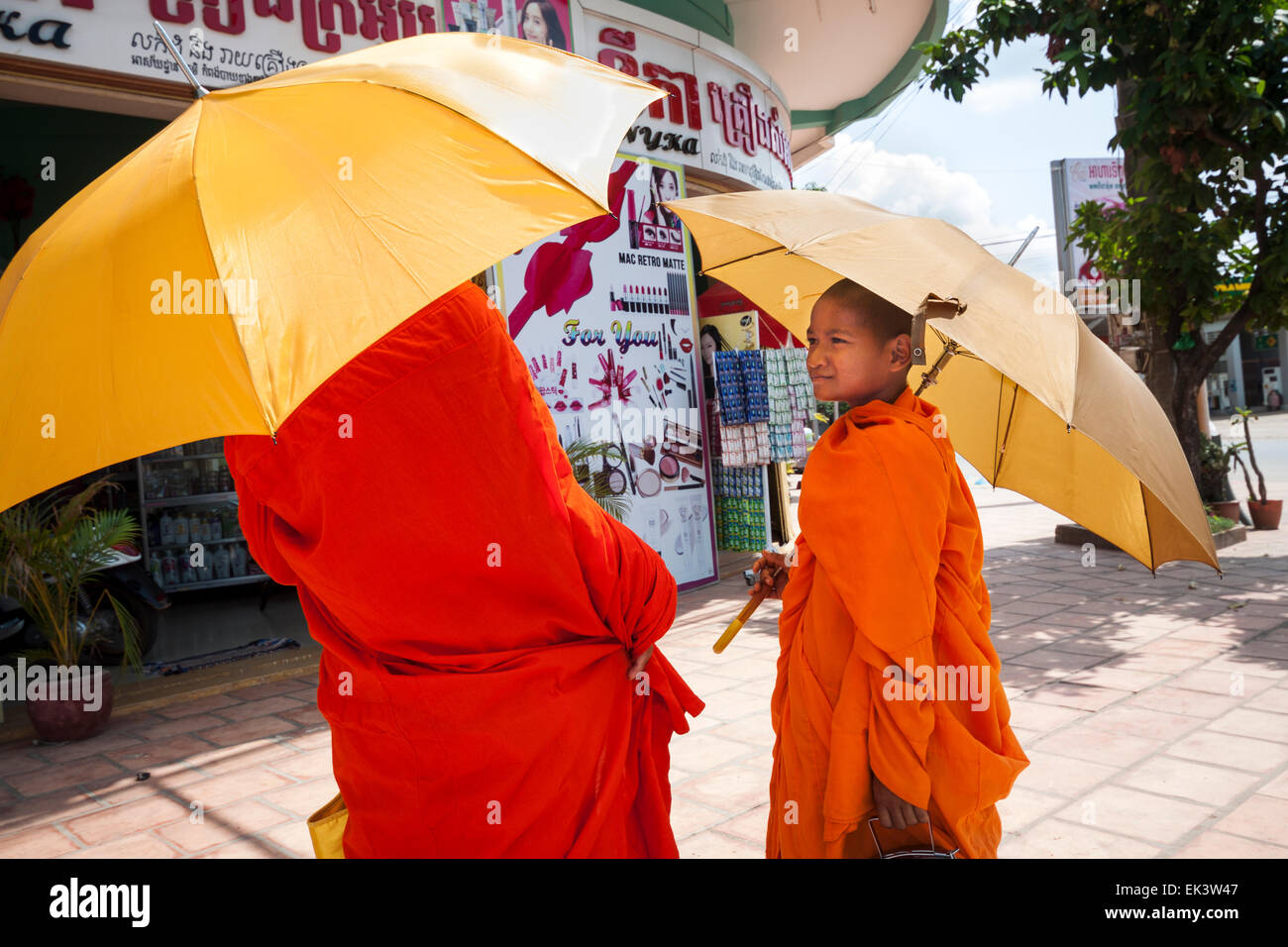 Buddhist monk in their round, begging for alms in Kampot, Cambodia ...