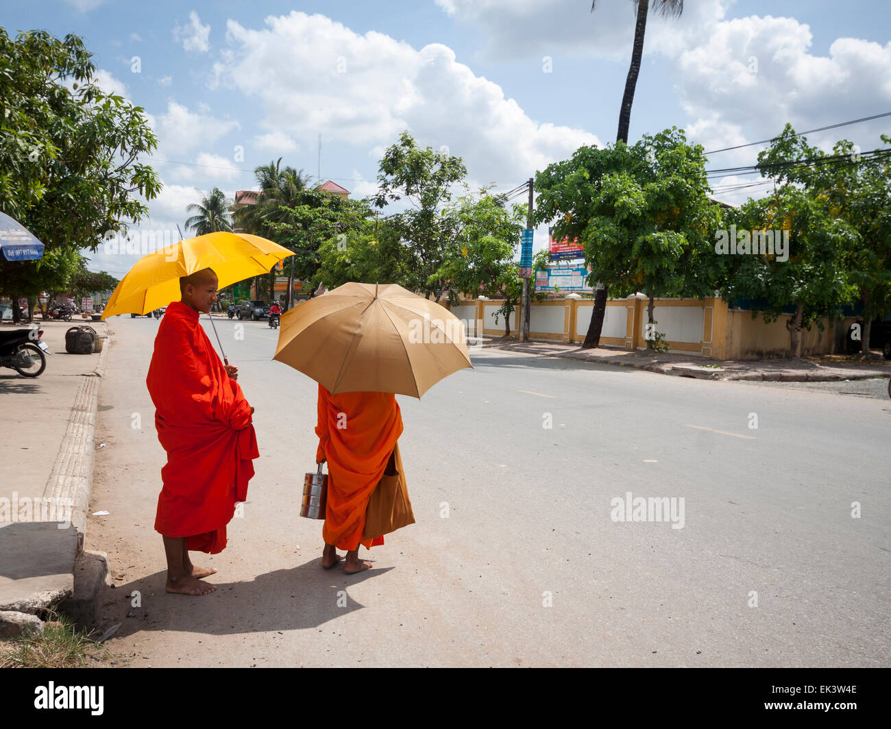 Buddhist monk in their round, begging for alms in Kampot, Cambodia ...
