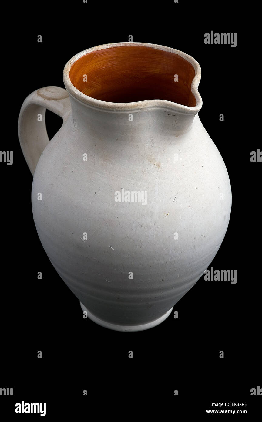 White jug on black background Stock Photo - Alamy