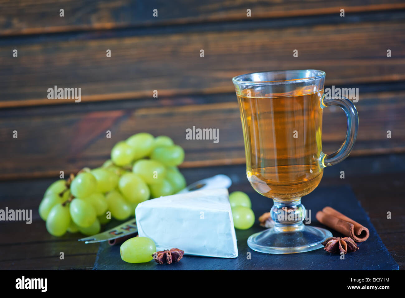 cider and cheese on the wooden board Stock Photo - Alamy